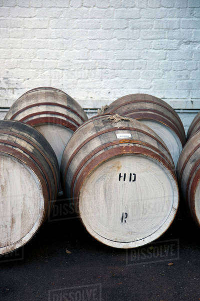 Wooden barrels at a whiskey distillery - Stock Photo - Dissolve