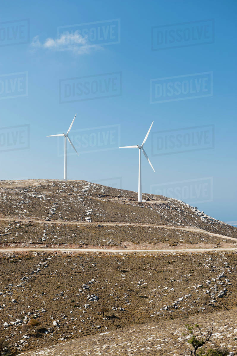 Two wind turbines on a hill, Rhodes, Greece - Royalty-free Stock Photo ...