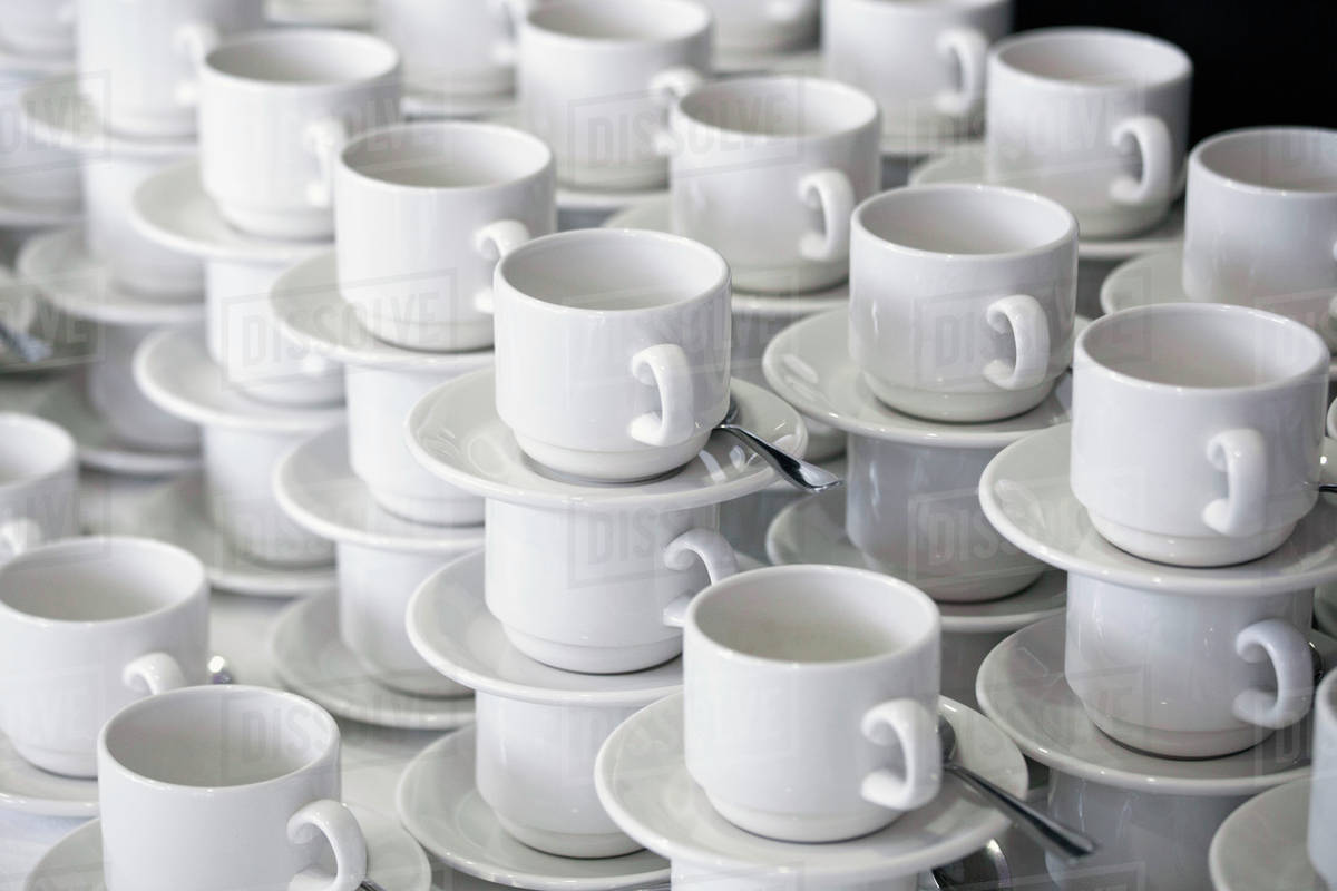 Stacks of cups and saucers - Stock Photo - Dissolve