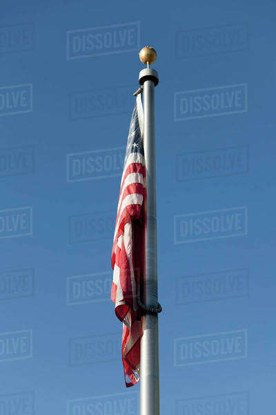 An American flag hanging down - Stock Photo - Dissolve