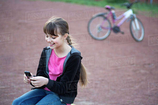 A girl text messaging - Royalty-free Stock Photo | Dissolve