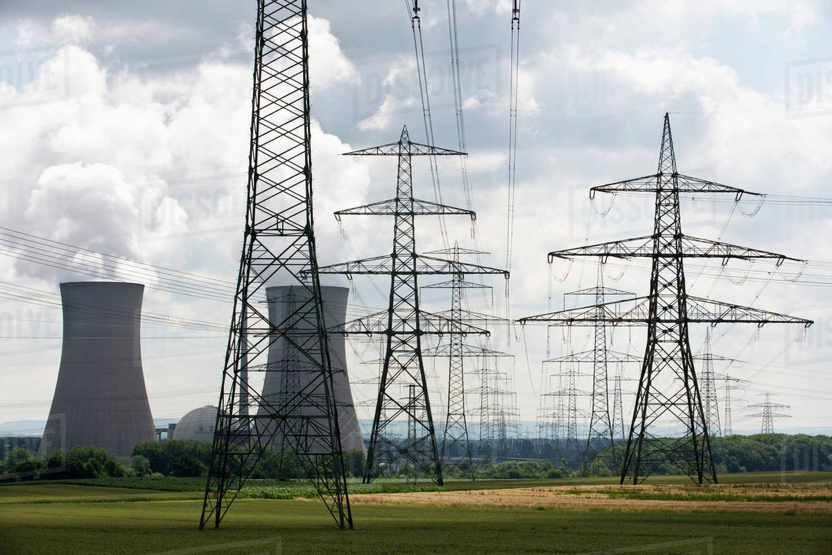Electricity pylons in front of a nuclear power station, Grafenrheinfeld ...
