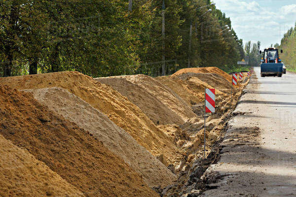 Range of sand mounds on roadside - Royalty-free Stock Photo | Dissolve