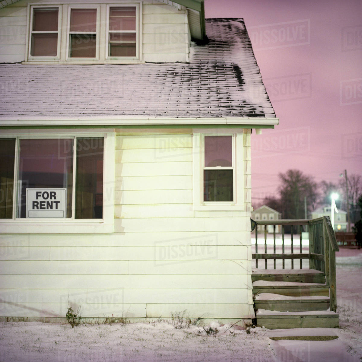 A For Rent Sign, in the window of a white house at night, long exposure ...