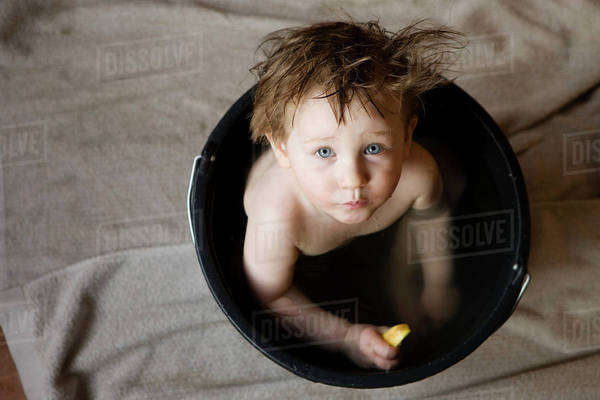 Baby girl taking bath in bucket, portrait - Royalty-free Stock Photo ...