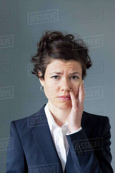 Mid adult woman with worried expression, close-up - Royalty-free Stock ...