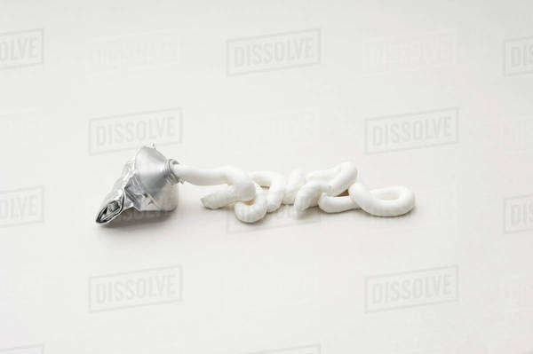 Toothpaste squeezed of tube against white background - Stock Photo ...