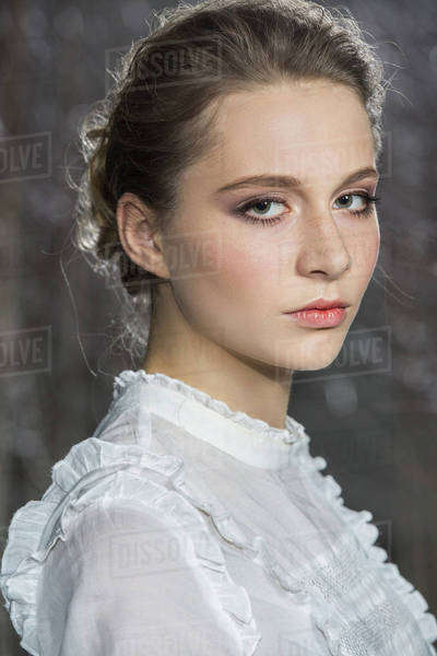 Side view portrait of beautiful young woman - Stock Photo - Dissolve