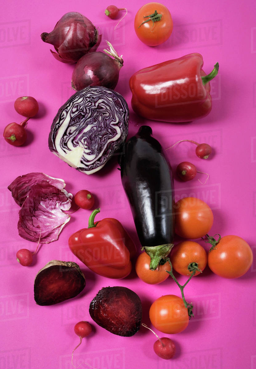 Arrangement of red and purple vegetables on a pink background - Stock ...