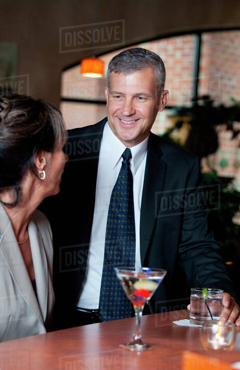Two business people at a bar - Royalty-free Stock Photo | Dissolve