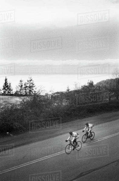 Two men riding racing bicycles, rural setting - Royalty-free Stock ...