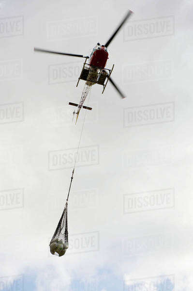 Helicopter carrying bundle - Royalty-free Stock Photo | Dissolve