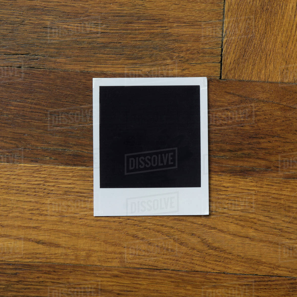 Blank instant camera print on wooden table - Royalty-free Stock Photo ...