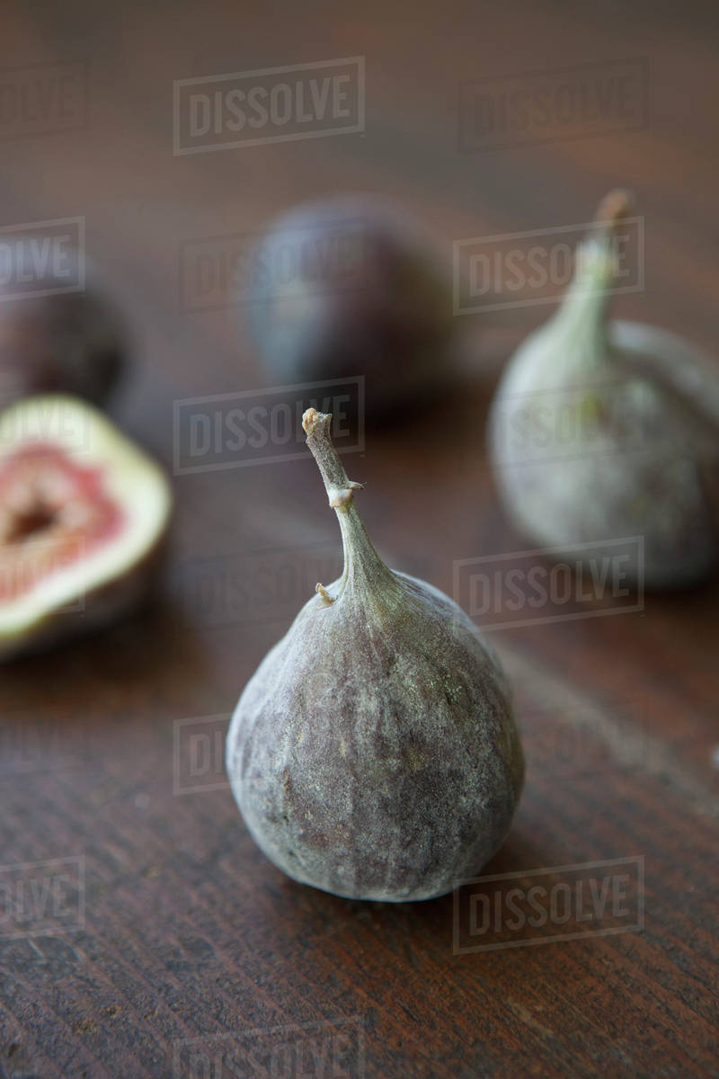 Close-up of fig on table - Royalty-free Stock Photo | Dissolve