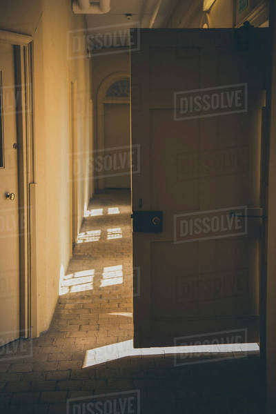 Open door at corridor - Royalty-free Stock Photo | Dissolve