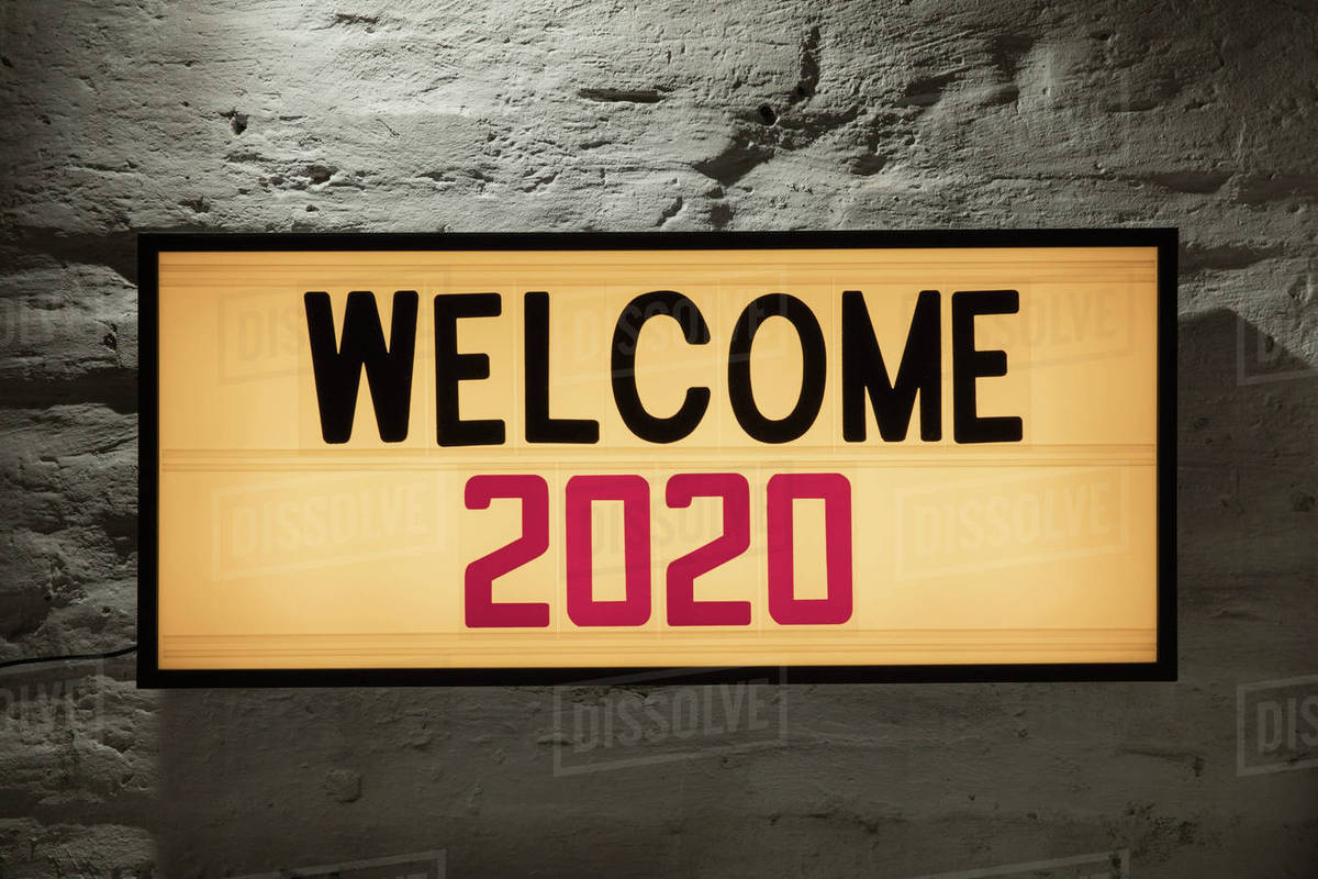 Close-up of Welcome 2020 signboard against gray wall - Royalty-free ...