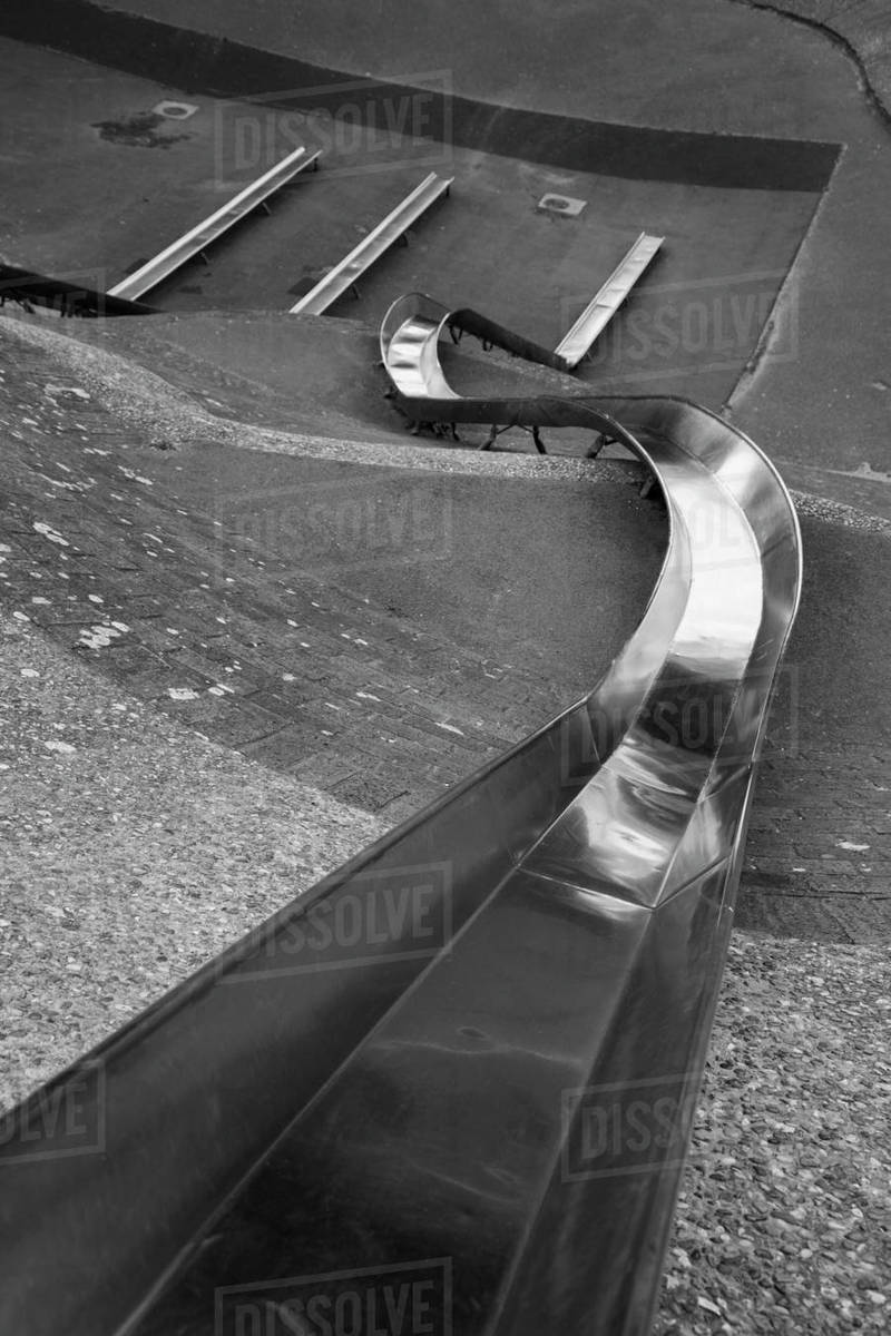 High angle view of long metal slide in park - Royalty-free Stock Photo ...