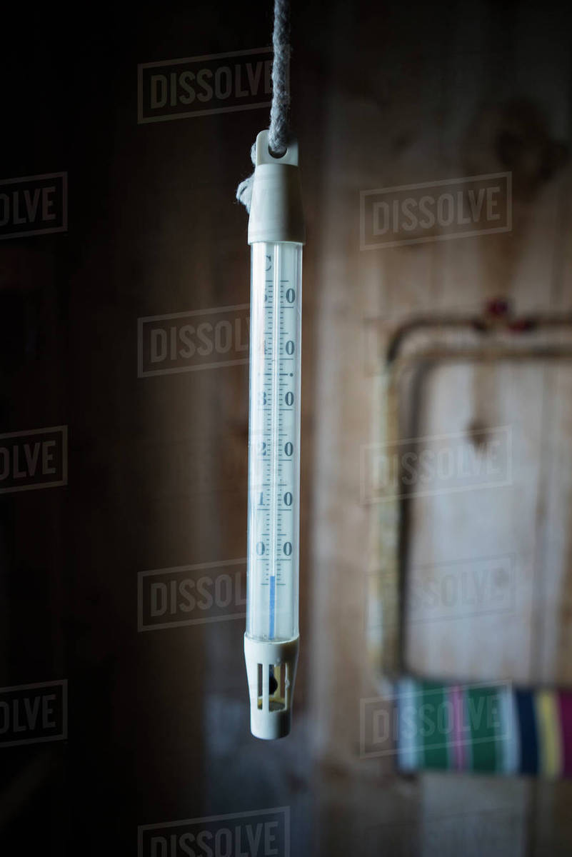 Close-up of thermometer hanging in storage room - Stock Photo - Dissolve