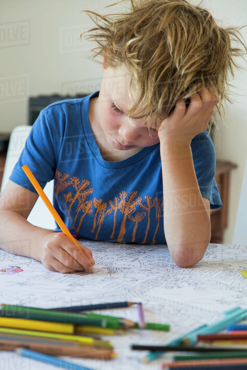 Focused boy coloring - Royalty-free Stock Photo | Dissolve