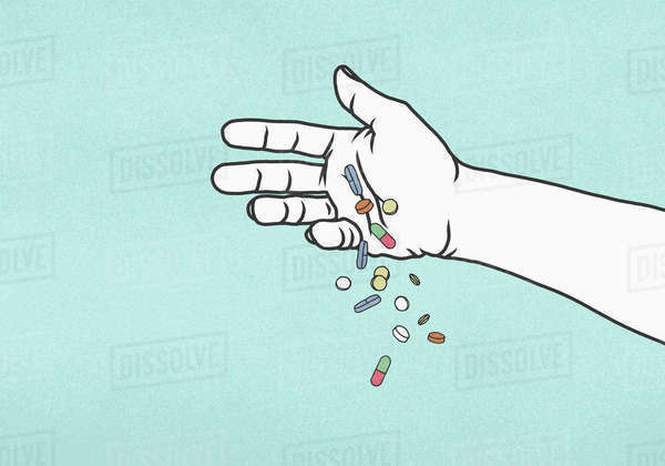 Hand dropping pills on blue background - Stock Photo - Dissolve