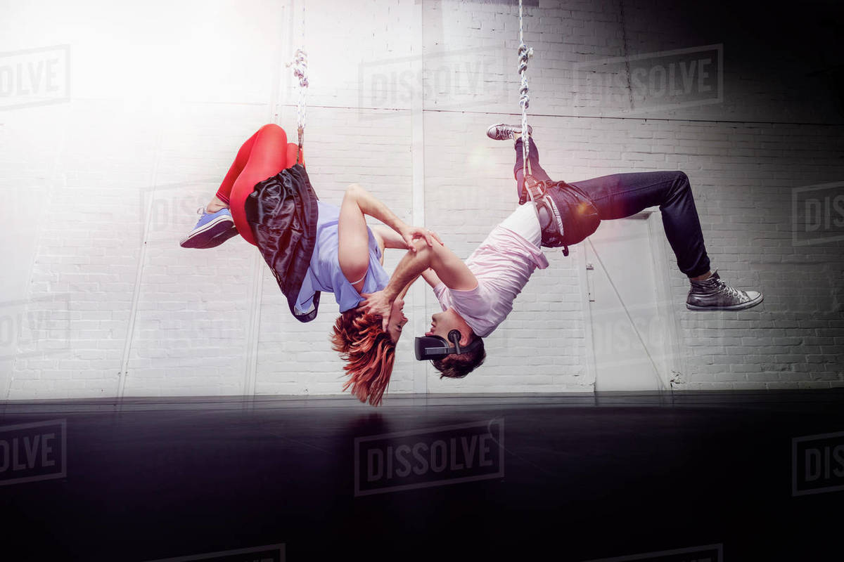 Modern aerialist dancers hanging - Royalty-free Stock Photo | Dissolve
