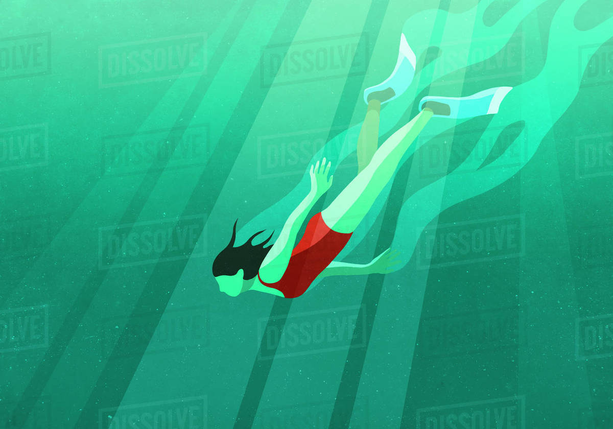 Woman diving underwater in ocean - Royalty-free Stock Photo | Dissolve
