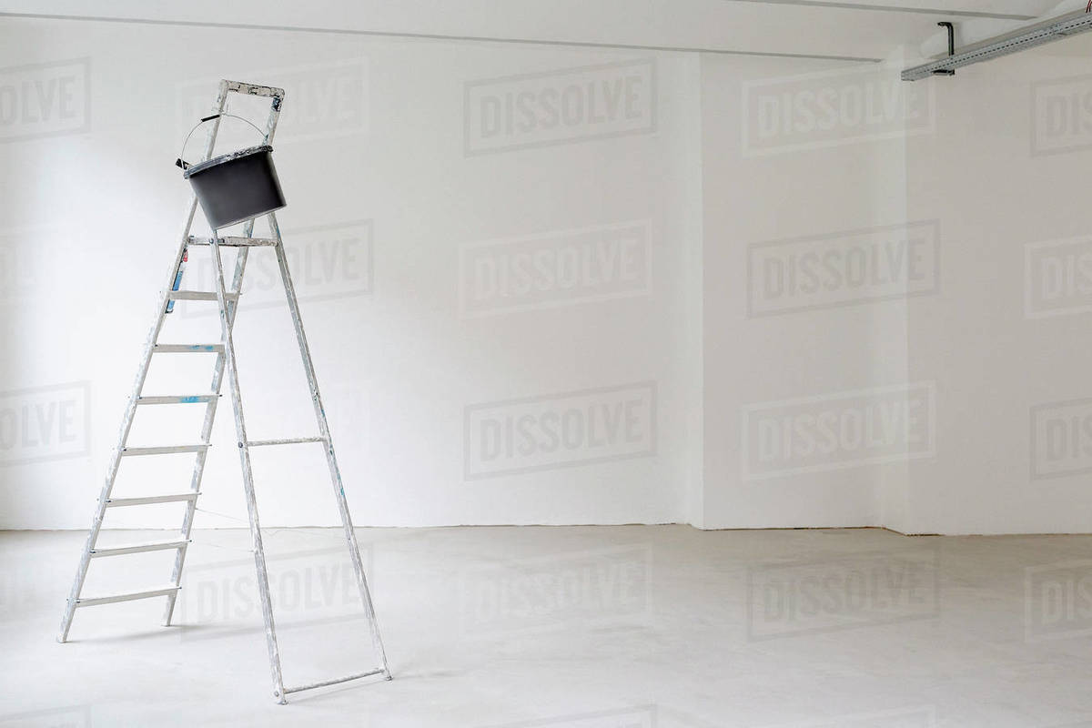 Ladder in empty room at construction site - Stock Photo - Dissolve
