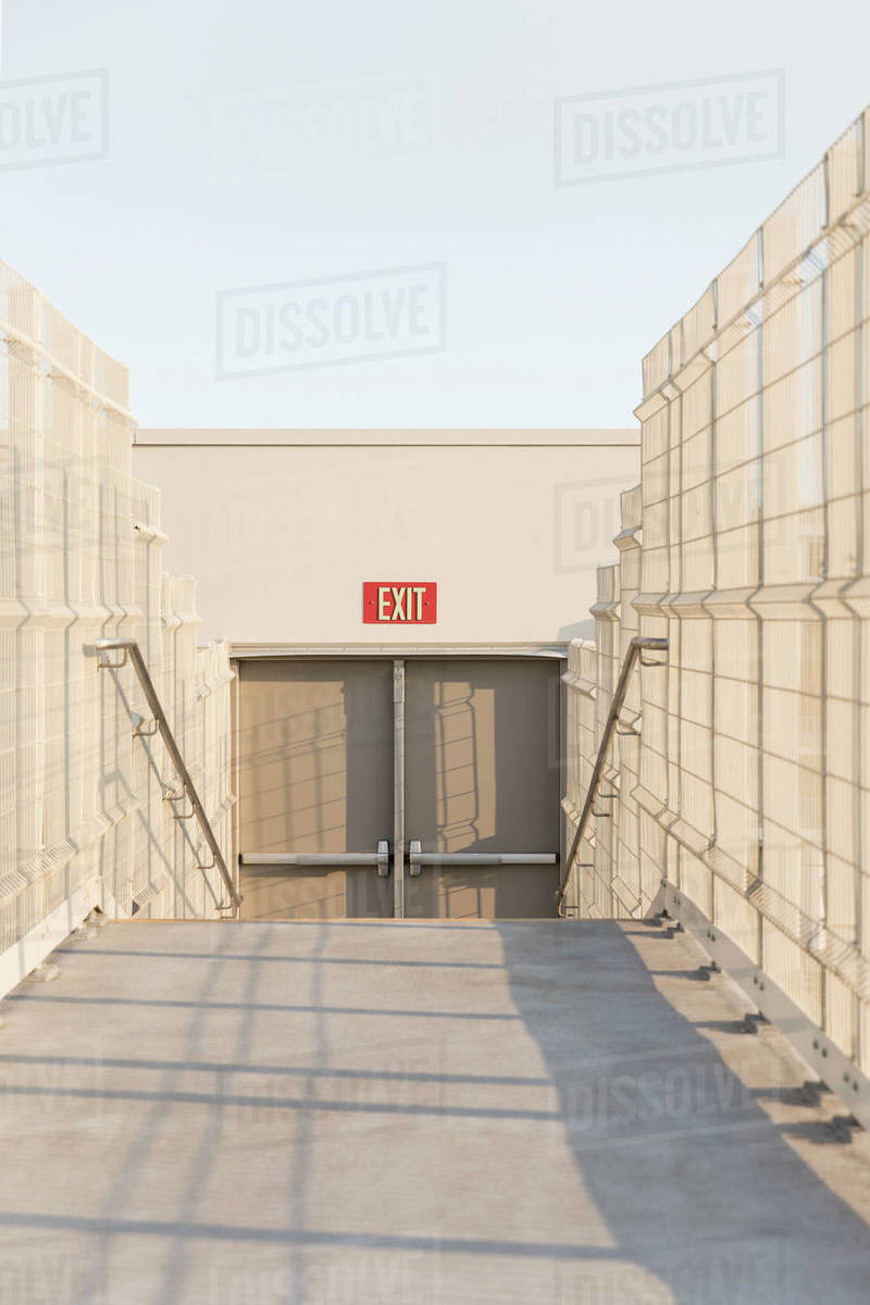 Exit sign above double doors on rooftop - Royalty-free Stock Photo ...