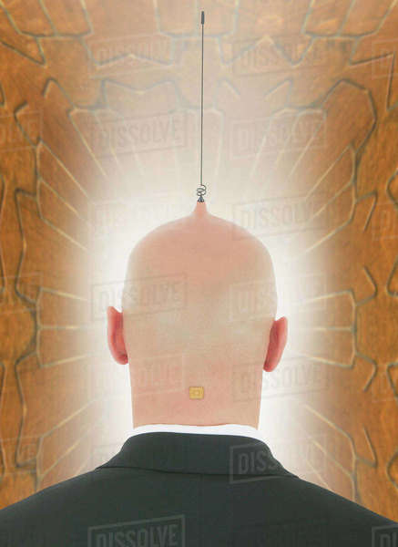 Businessman with antenna and computer chip in head - Stock Photo - Dissolve