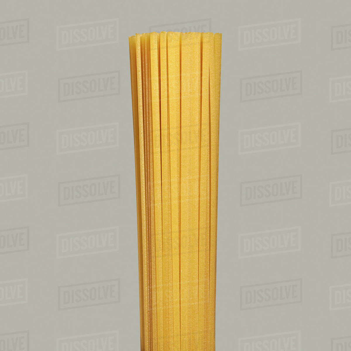 Bunch of uncooked spaghetti noodles - Royalty-free Stock Photo | Dissolve