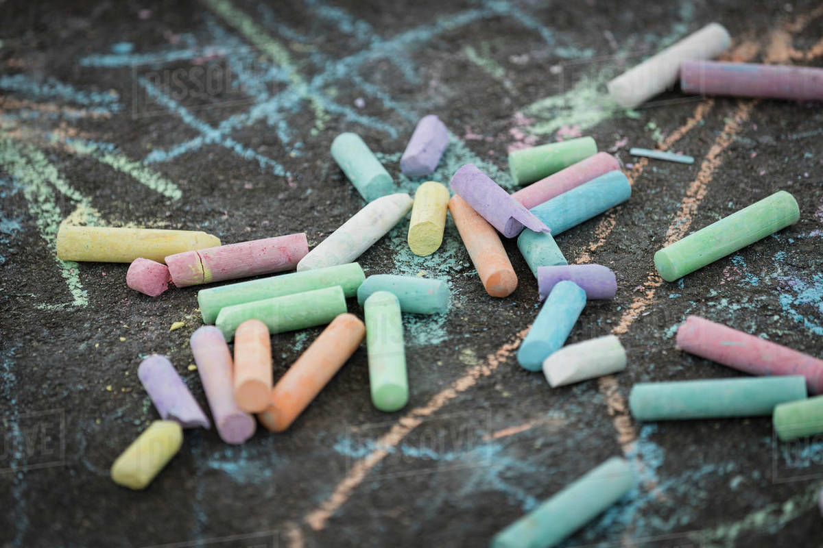 Multicolor sidewalk chalk pieces - Stock Photo - Dissolve