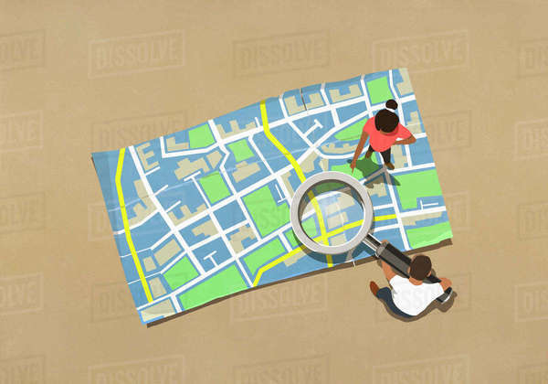 Couple with magnifying glass over map - Stock Photo - Dissolve