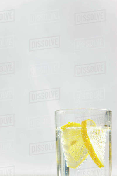 Close up of a glass of sparkling water and sliced lemon - Stock Photo ...