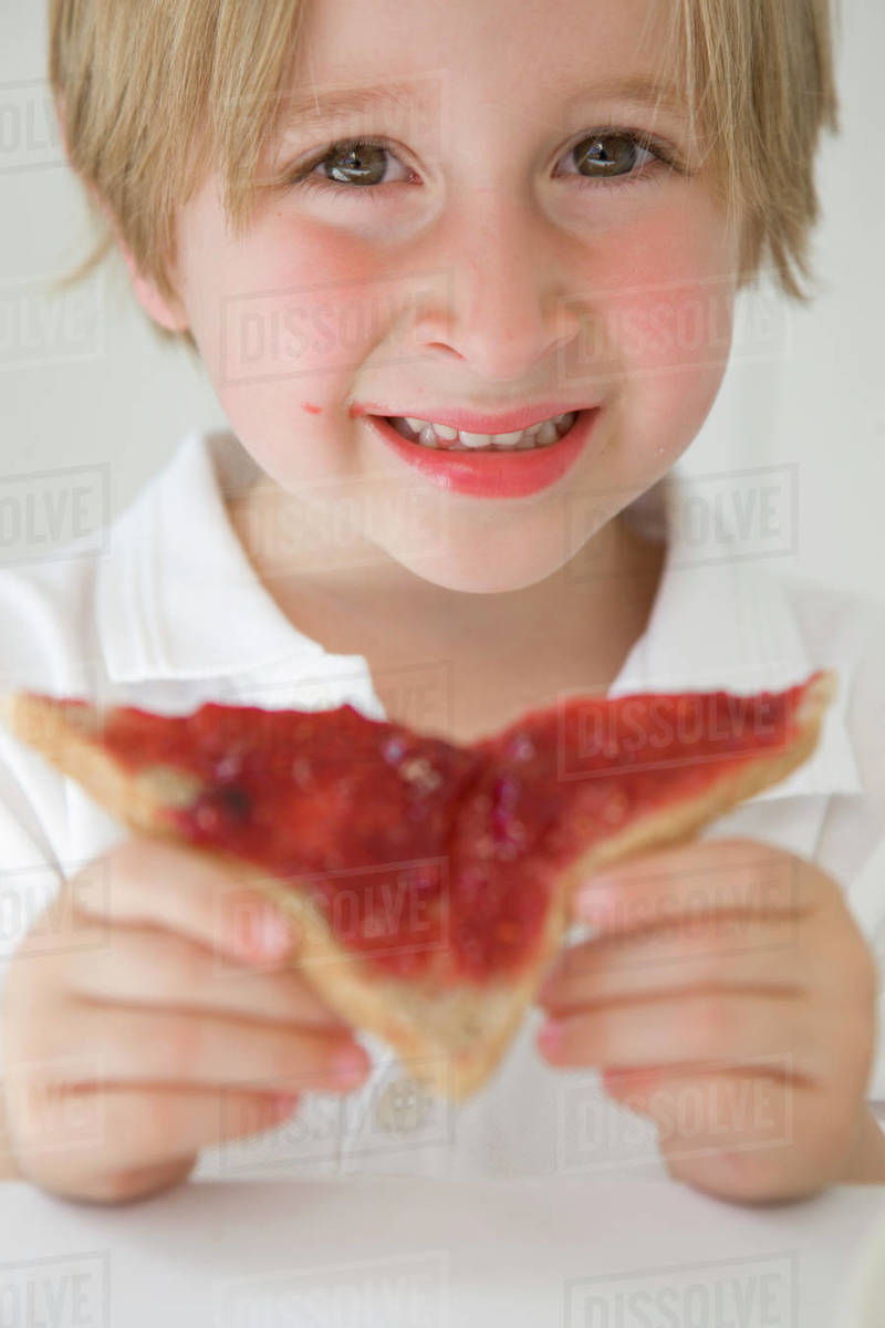 Boy Eating Jam on Toast - Royalty-free Stock Photo | Dissolve