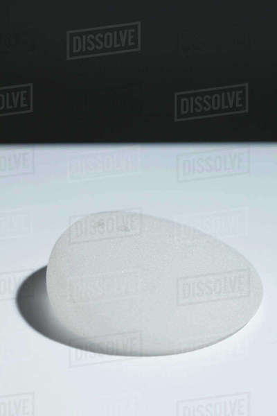 Breast Implant on black and white background - Stock Photo - Dissolve