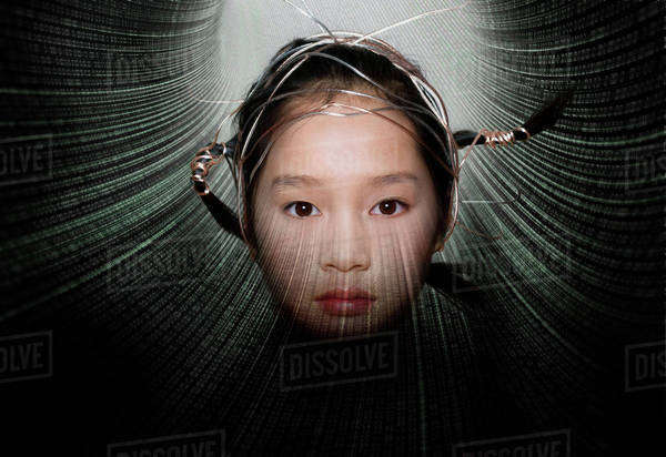 A teenage girl with wire wrapped around her head - Stock Photo - Dissolve
