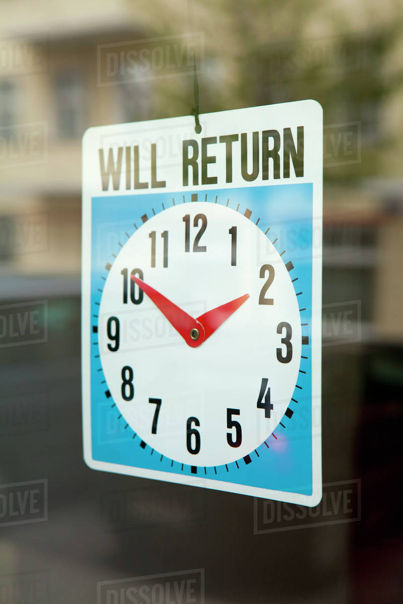 A WILL RETURN sign hanging in the window of a shop door - Stock Photo ...
